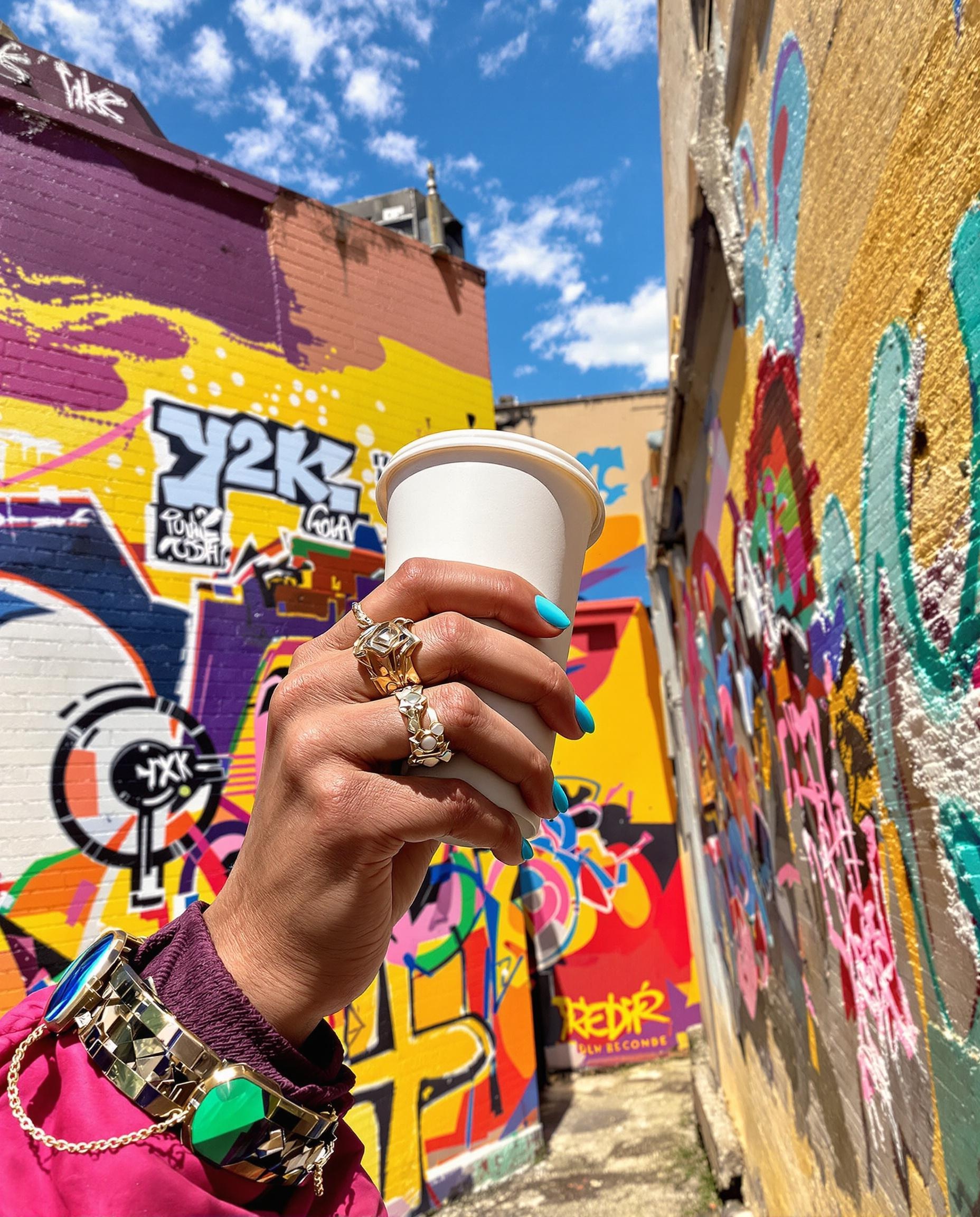Hand with Cup & Graffiti Photo on Lummi